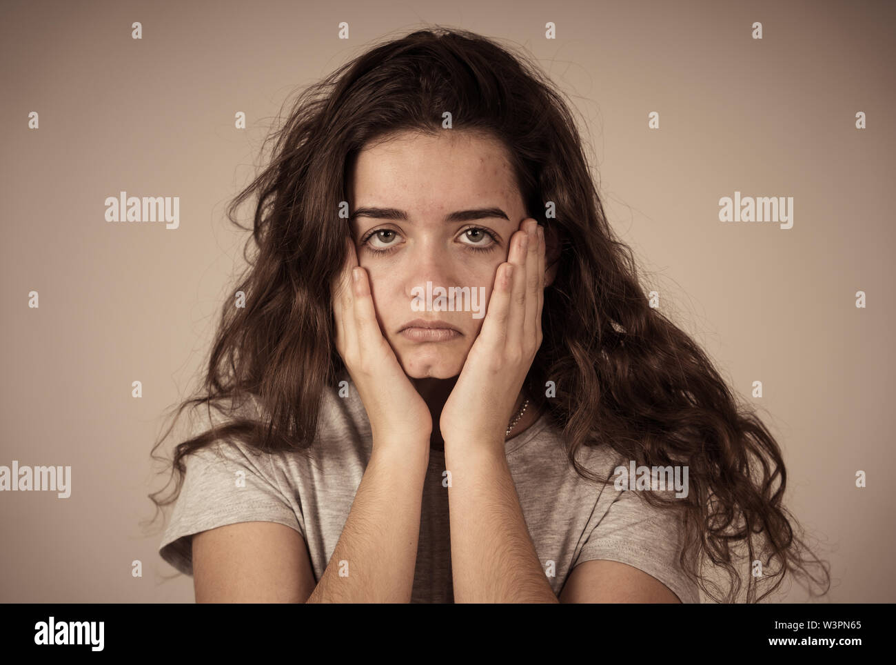 Portrait of beautiful sad miserable young teenager girl with unhappy ...