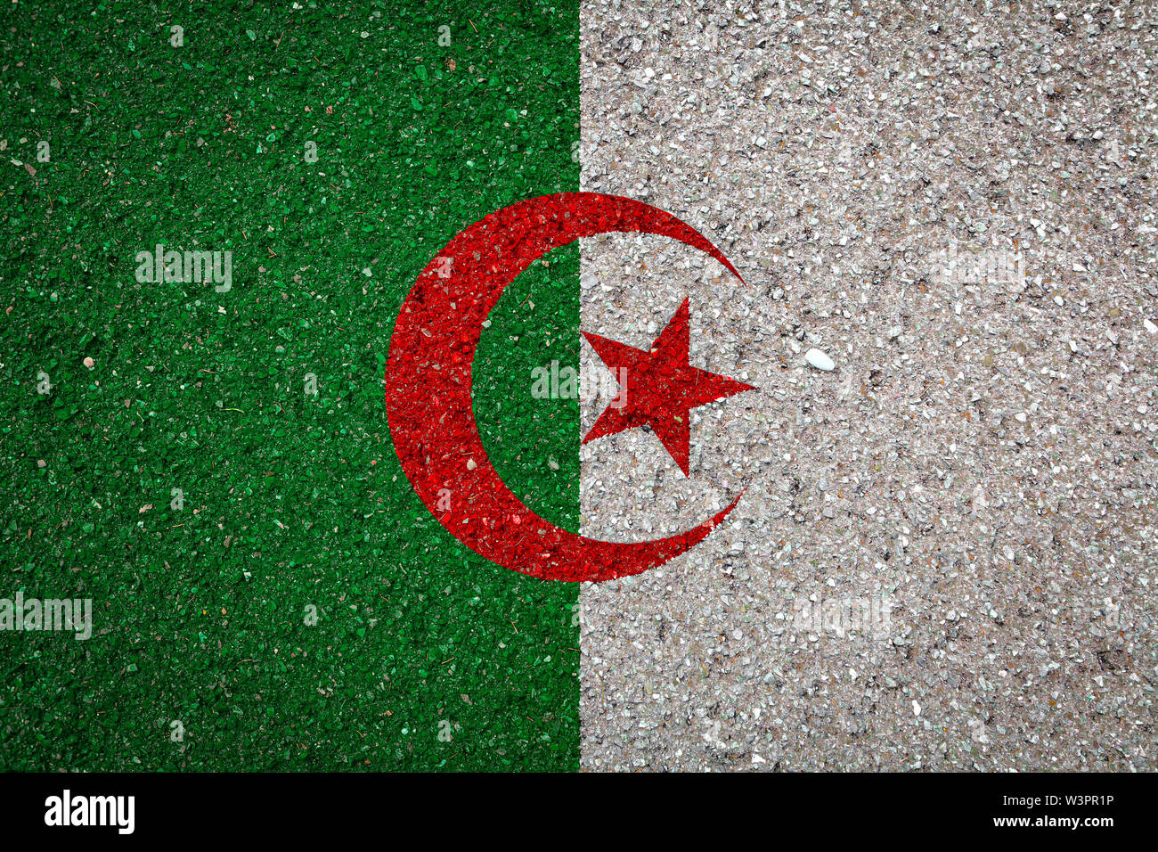 National flag of Algeria on a stone background.The concept of national ...