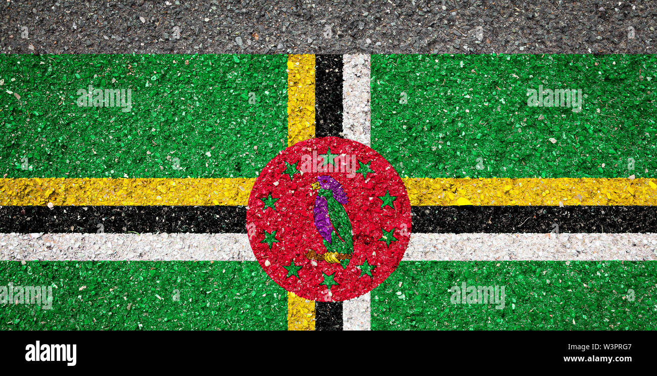 National flag of Dominica on a stone background.The concept of national ...