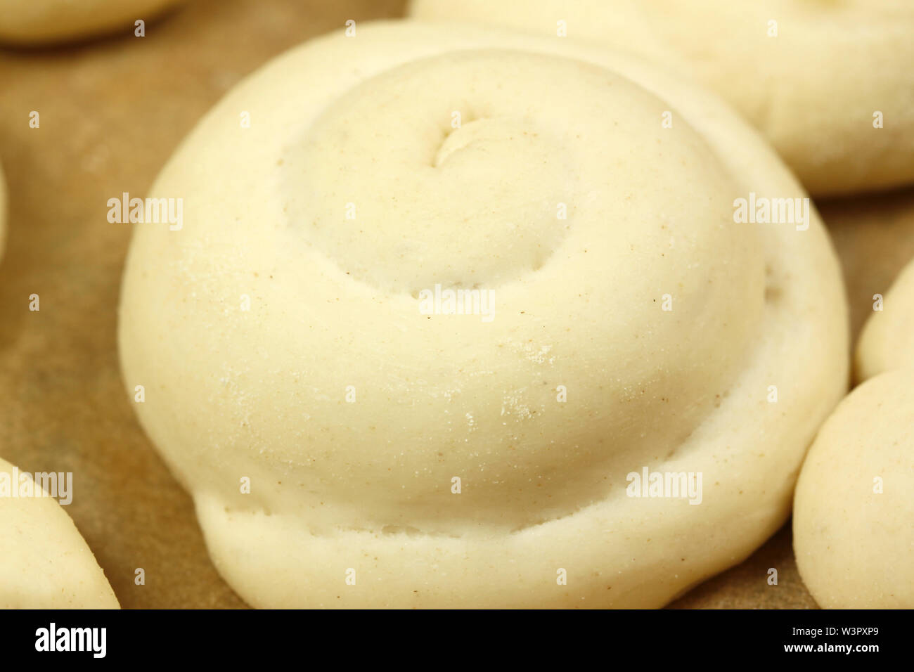 Raw yeast dough for buns. Growing stage Stock Photo - Alamy