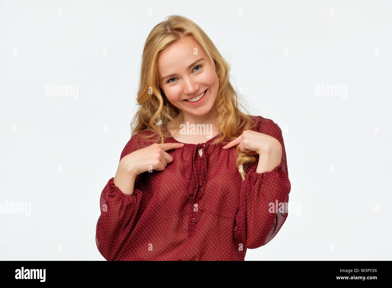 Happy woman pointing fingers at herself. Select me please concept Stock ...