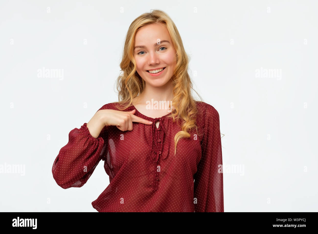 Happy woman pointing fingers at herself. Select me please concept Stock ...