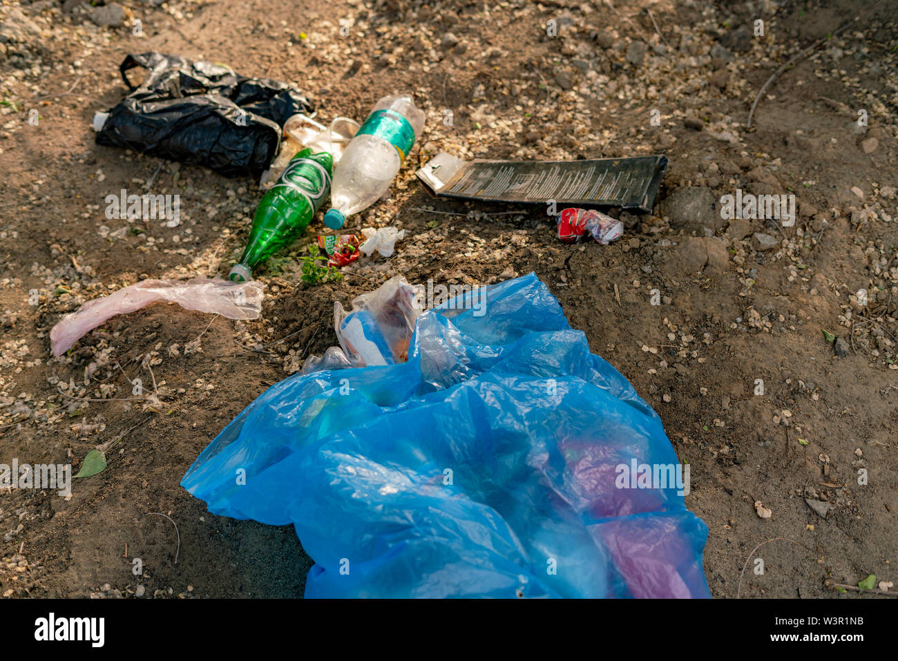 plastic garbage on the ground outdoor in the street Stock Photo - Alamy