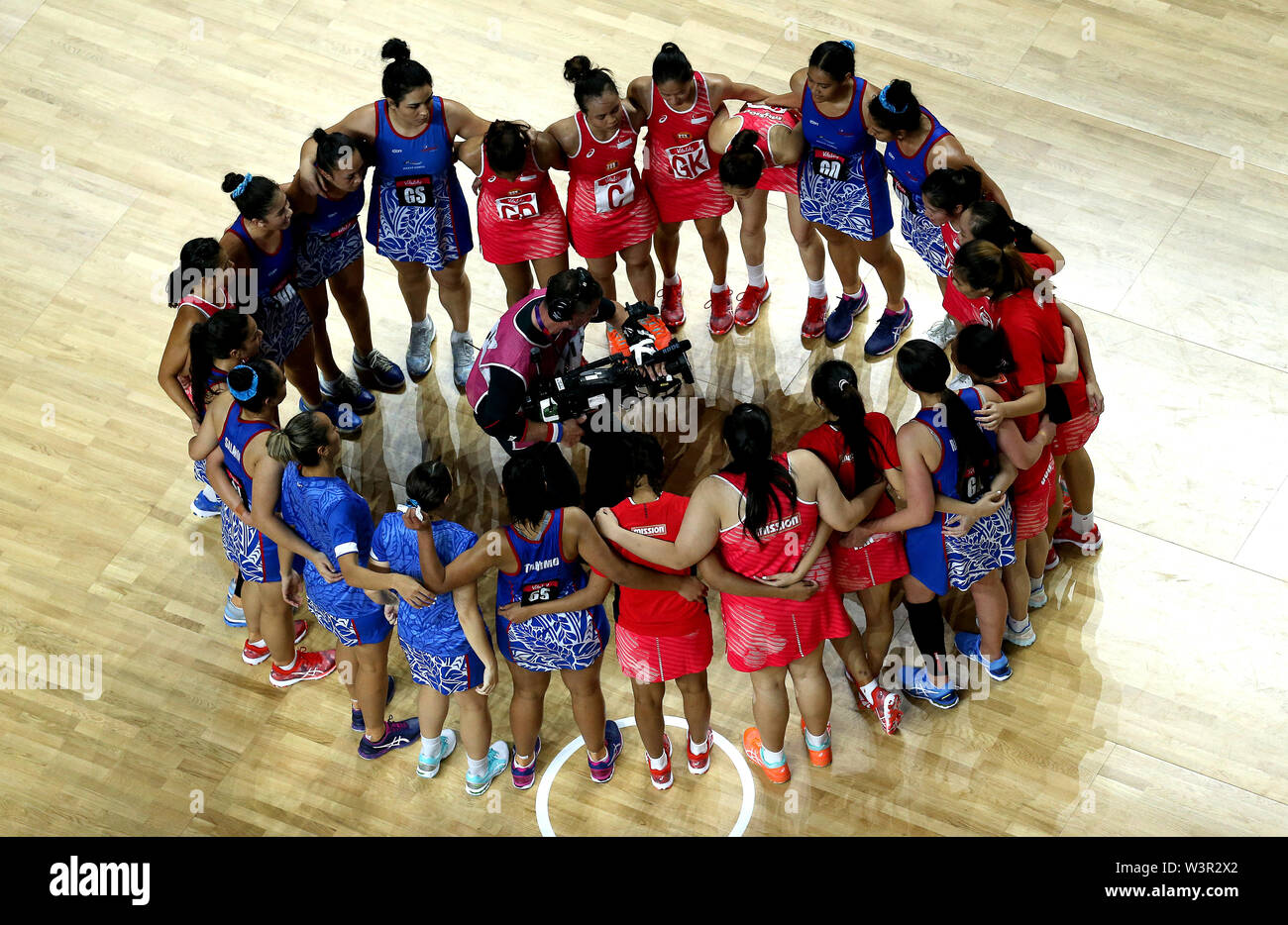 A huddle between the Singapore and Samoa teams after the match during ...