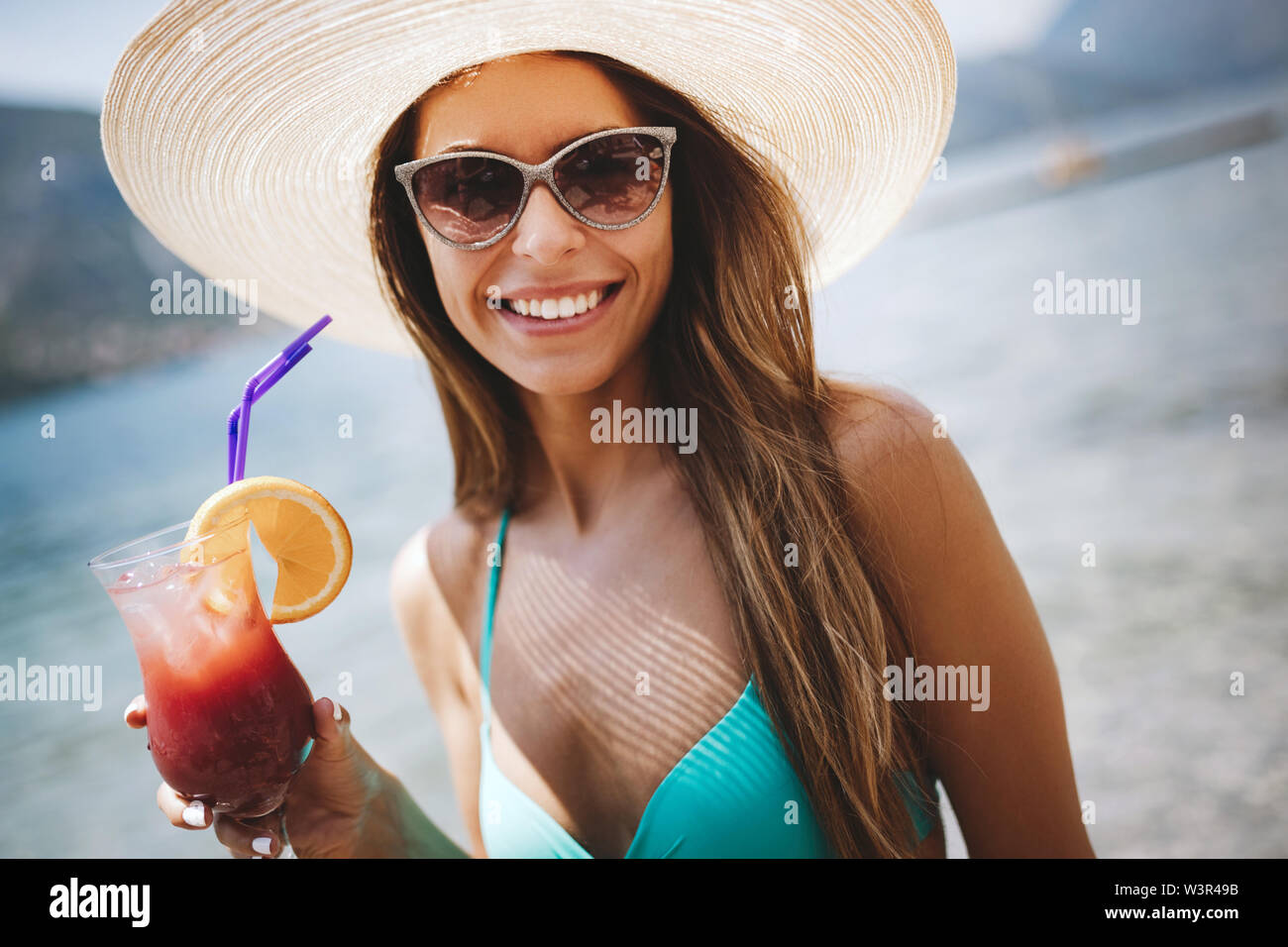 Happy Beautiful Woman Drinking Cocktails During Summer Vacation On