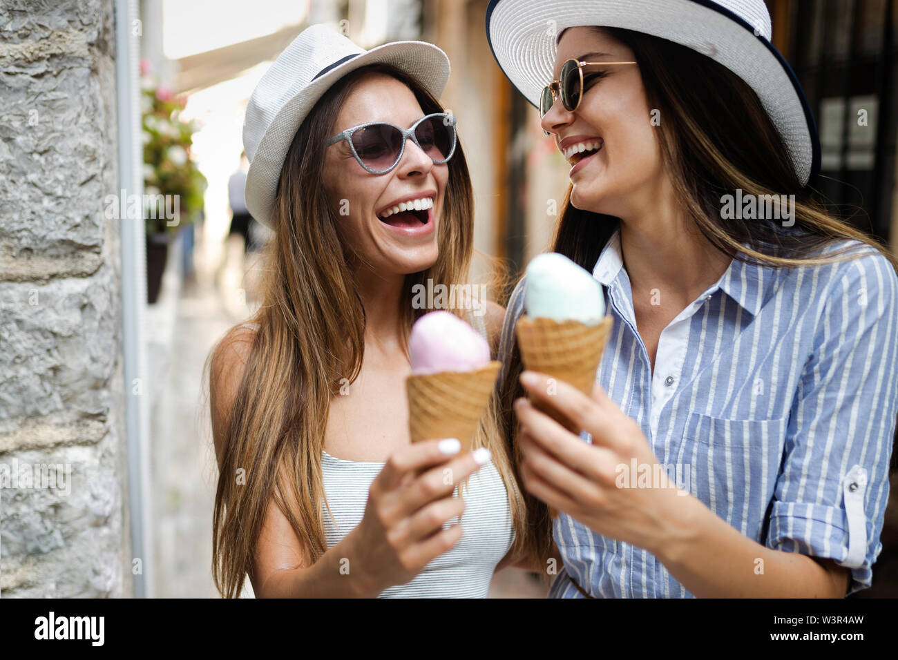 Happy young women friends having fun together at summer Stock Photo - Alamy