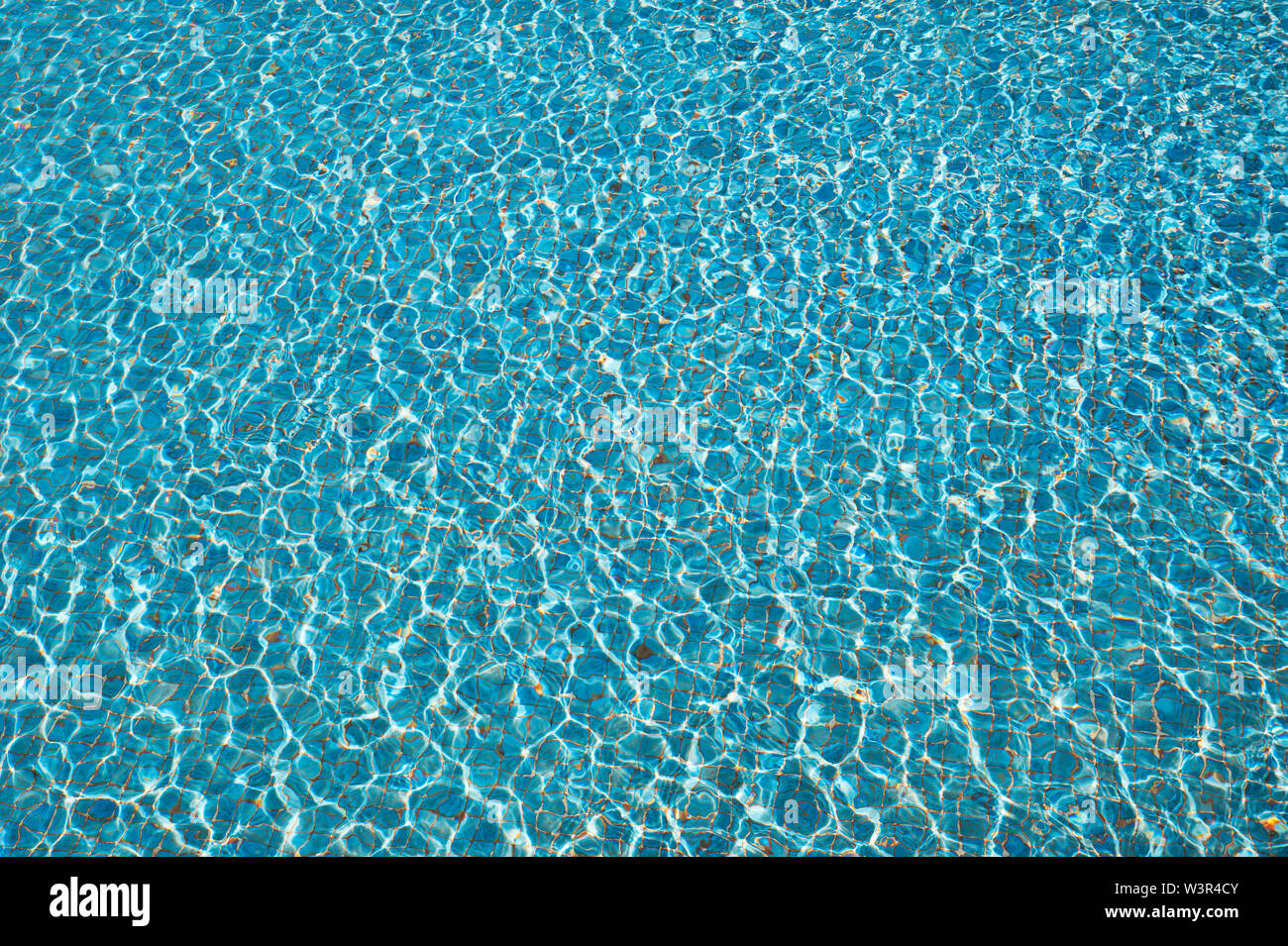 Swimming pool water background with texture of water surface with ...