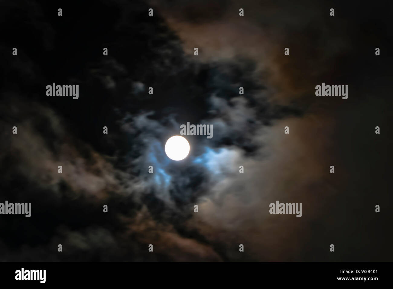 Moon flying through the clouds Stock Photo - Alamy