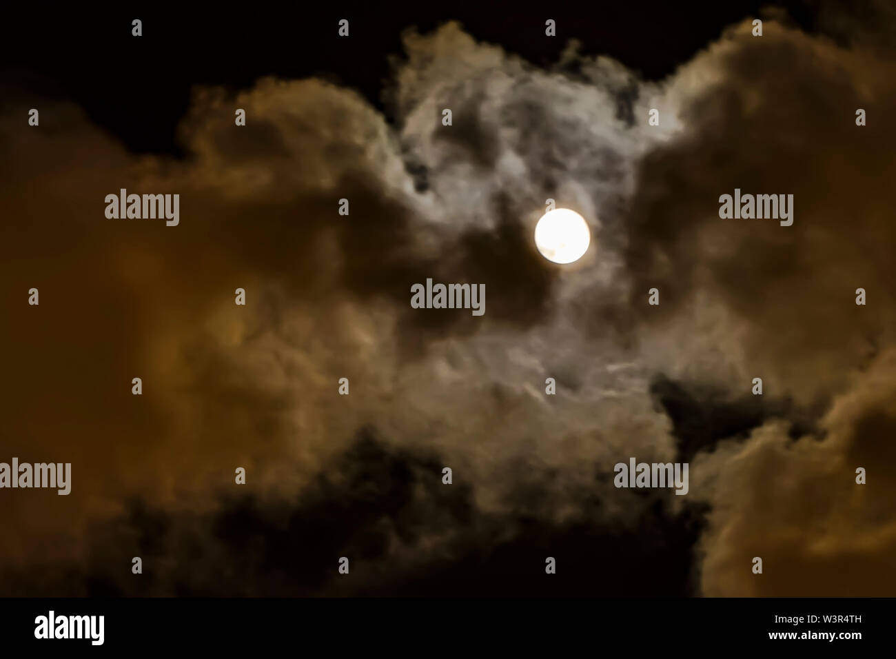 Moon flying through the clouds Stock Photo - Alamy