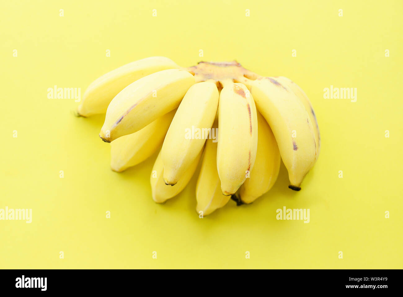 banana bunch on yellow background fresh and healthy fruit Stock Photo ...