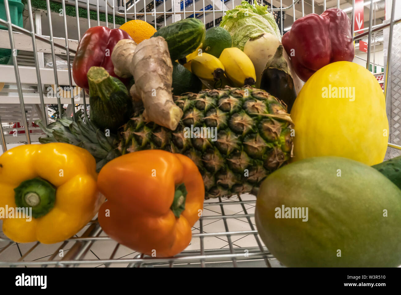 Vegetables and fruits, vegetarian healthy food, fill supermarket cart ...