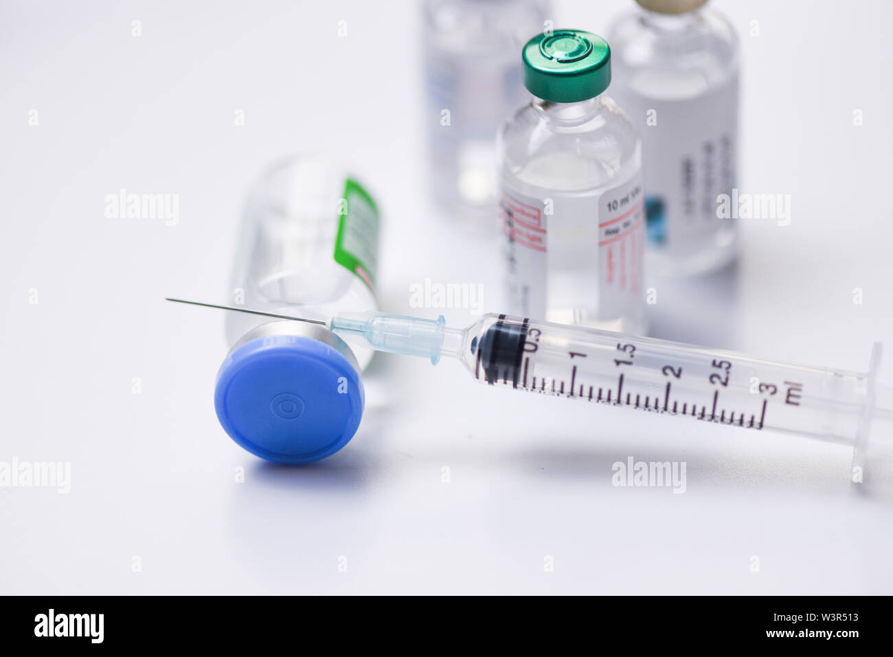 Medicine bottles glass for syringe injection needle on white background ...