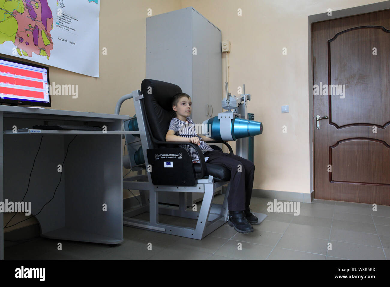 A boy living near the Chernobyl Exclusion Zone is checked with the ...