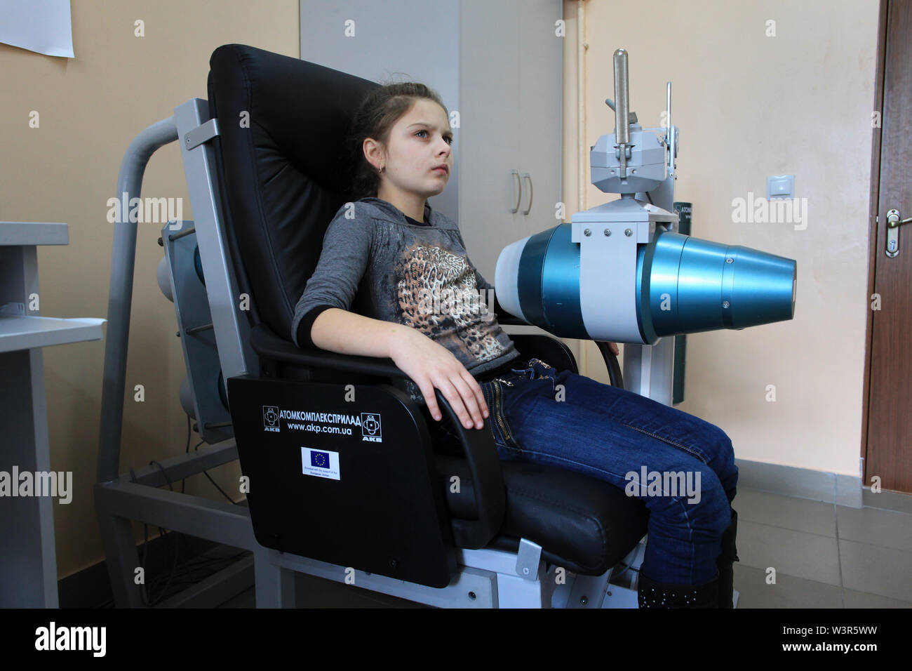 A girl living near the Chernobyl Exclusion Zone is checked with the ...
