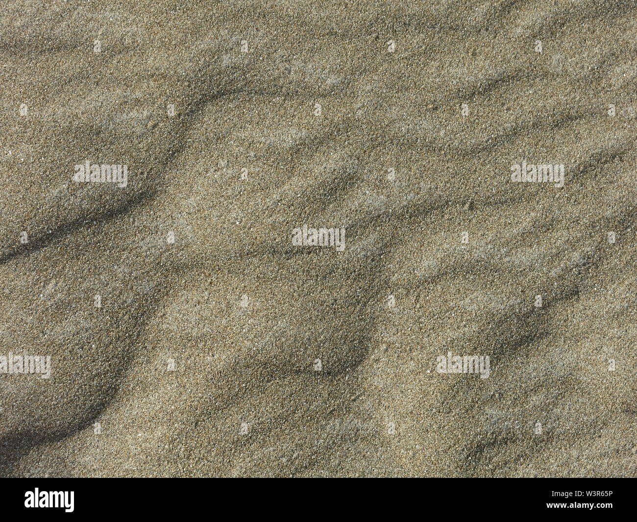 Sand shaped by wind and weather Stock Photo - Alamy