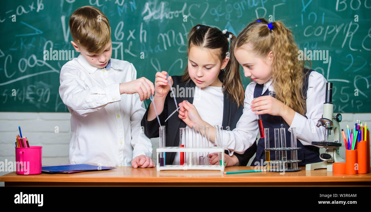 Teamwork concept. Test tubes with colorful liquid substances. Study of ...