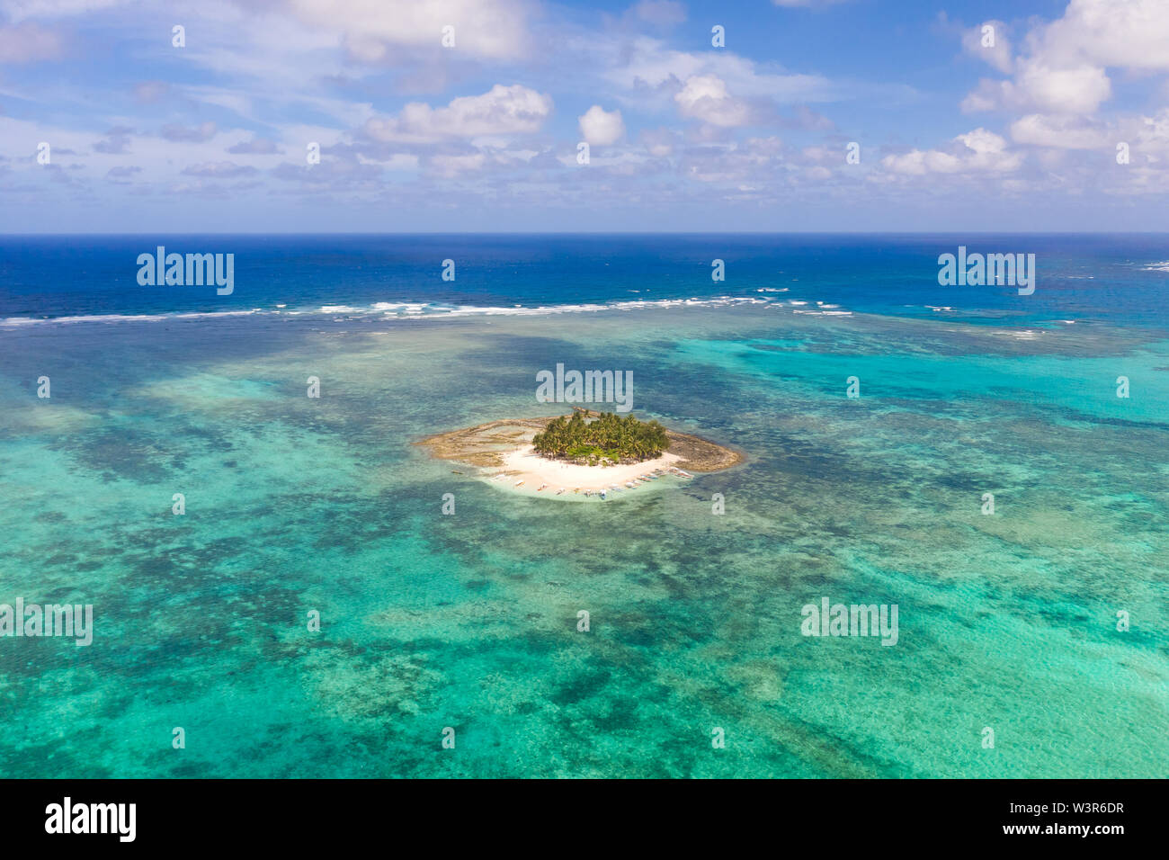 Guyam island, Siargao, Philippines. Small island with palm trees and a ...