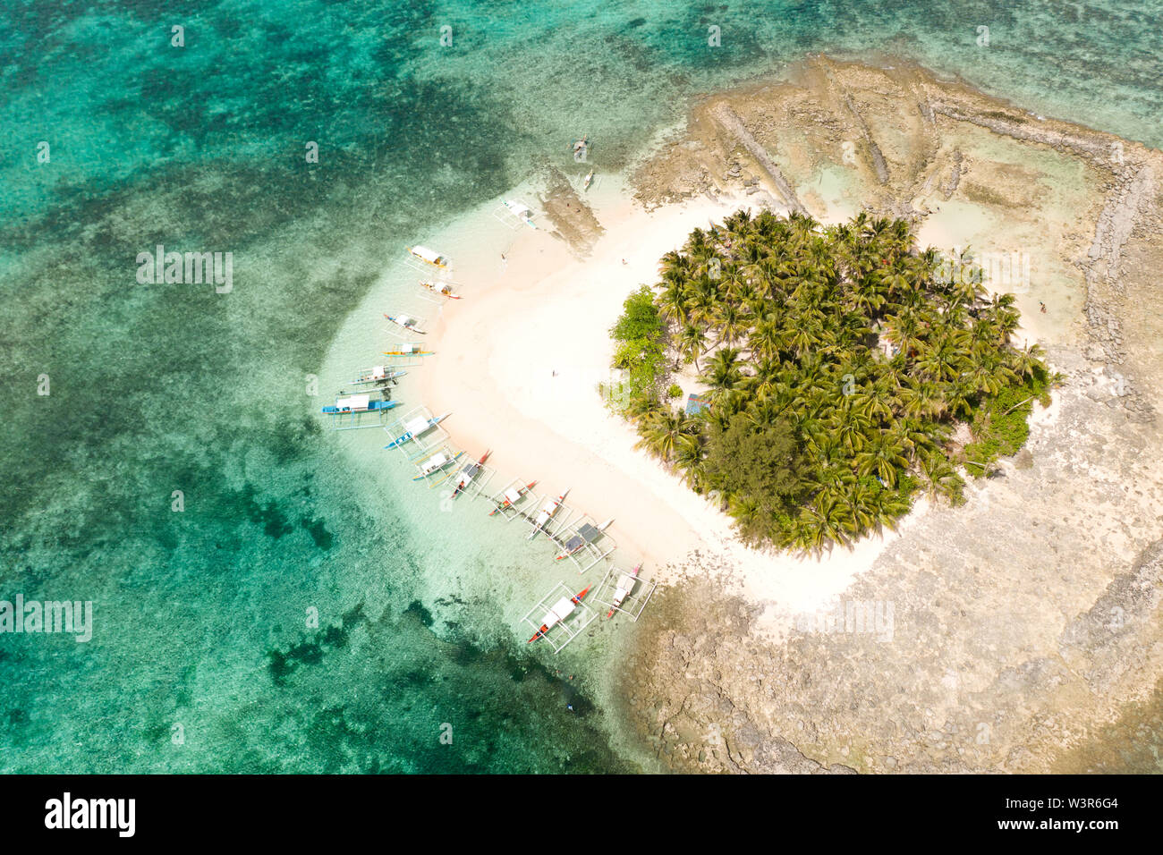 Guyam island, Siargao, Philippines. Small island with palm trees and a ...