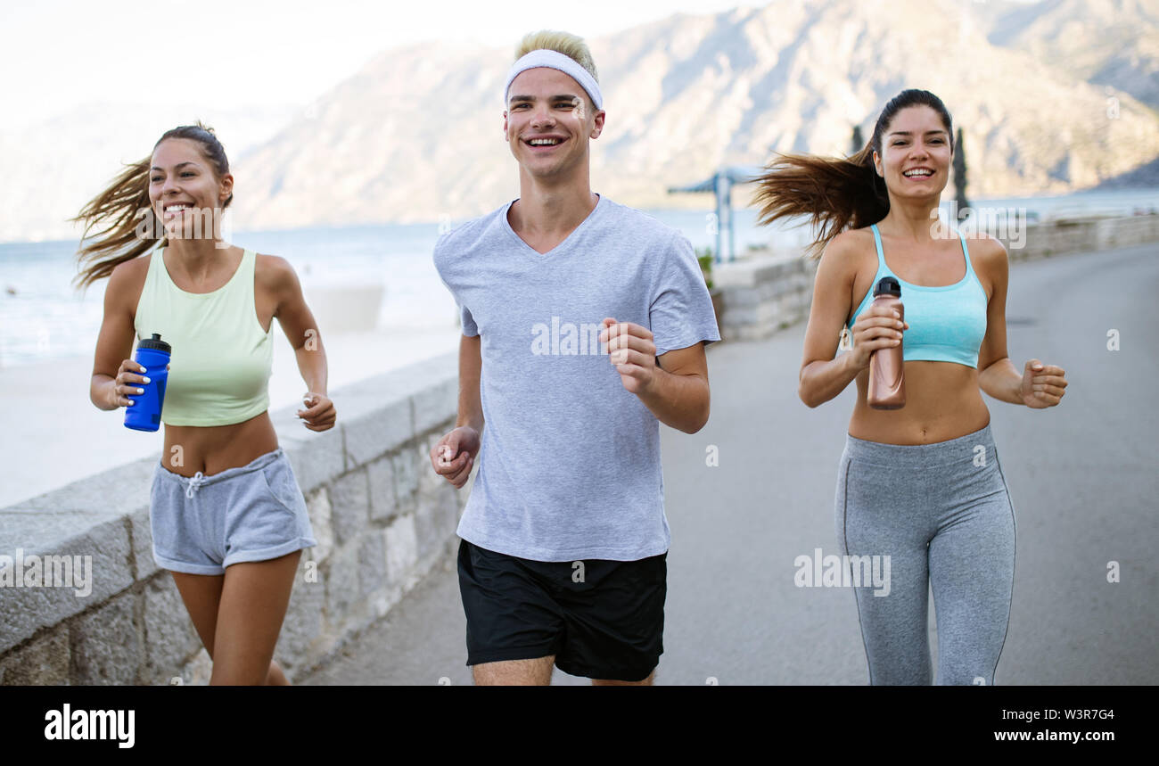 Group of young people jogging and running outdoors in nature Stock ...