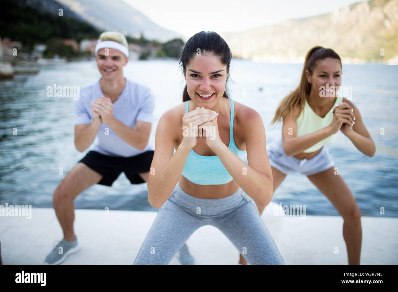 Friends fitness training together outdoors living active healthy Stock ...