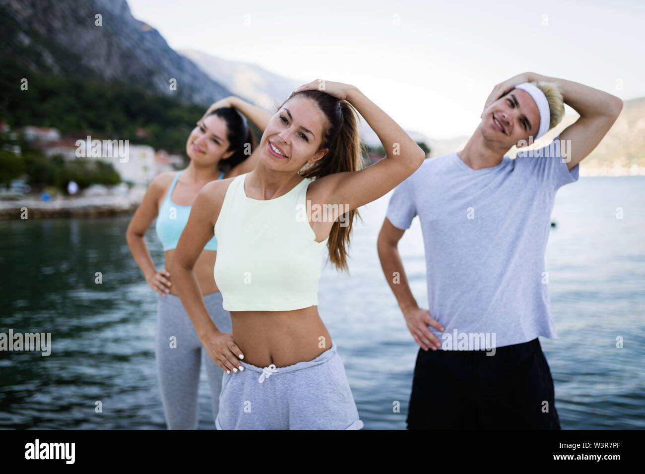 Friends fitness training together outdoors living active healthy Stock ...