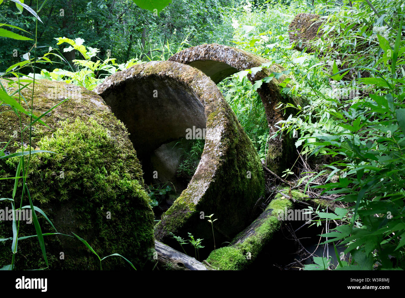 Concrete building rings for storm drainage stormwater are left in deep ...