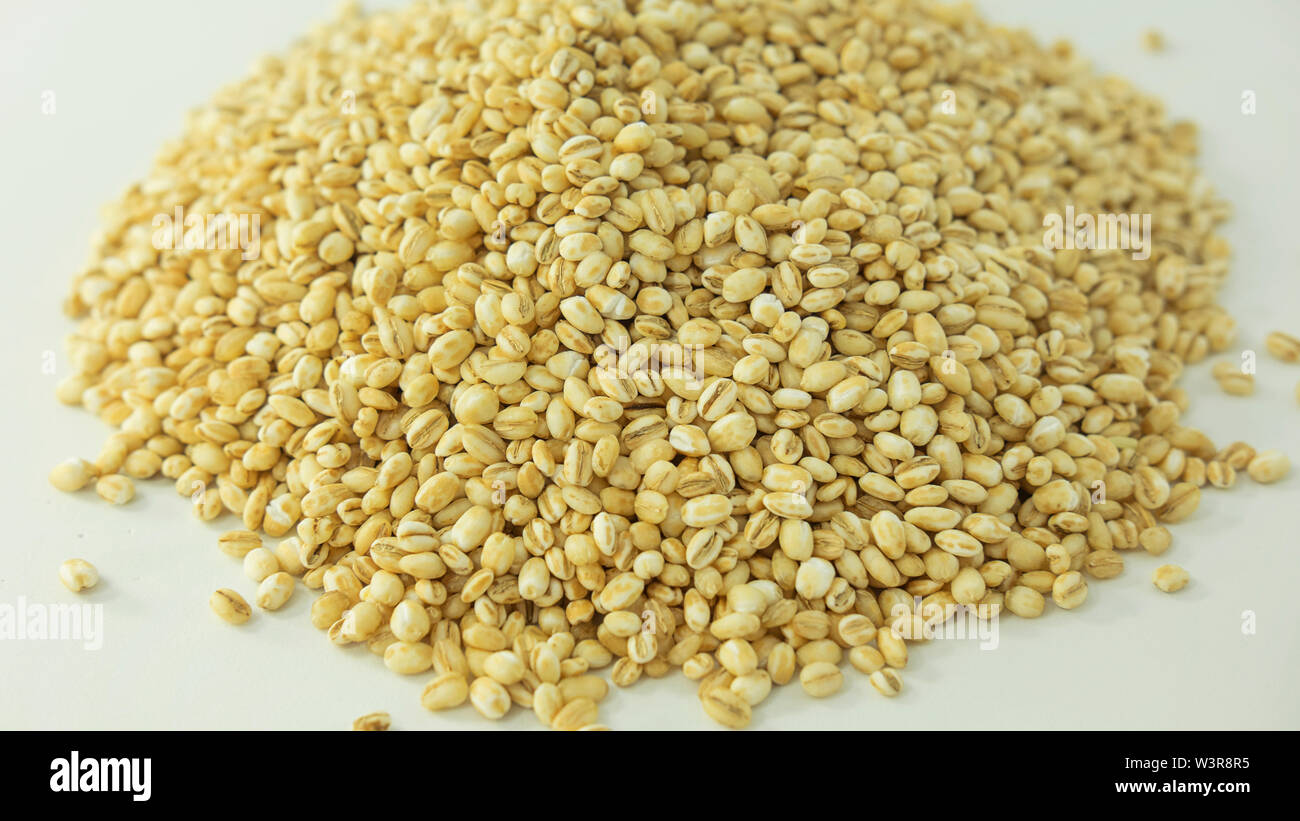 Stack of raw barley with hull removed, whole-grain cereal product with ...