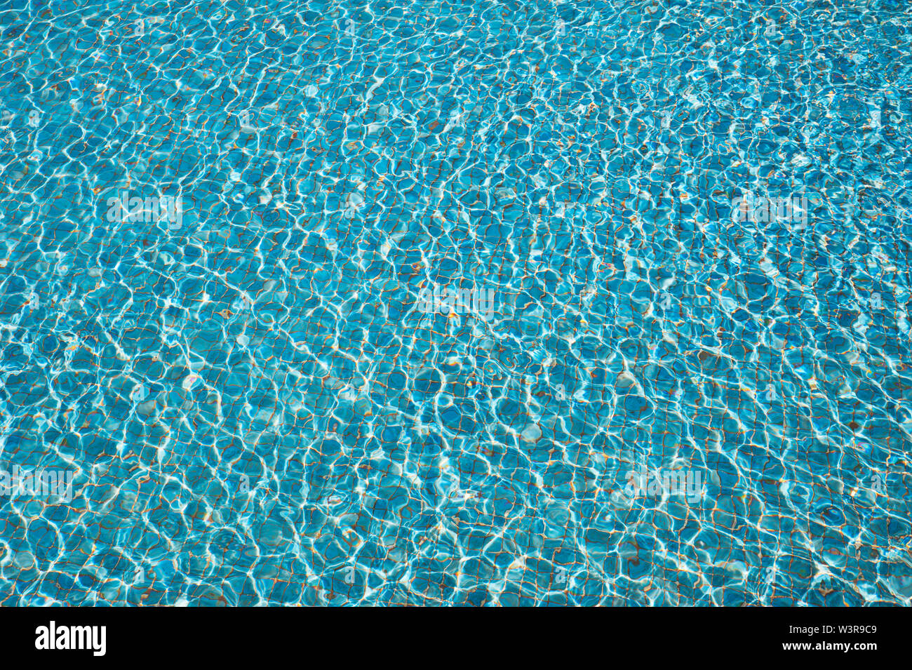 Swimming pool water background with texture of water surface with ...