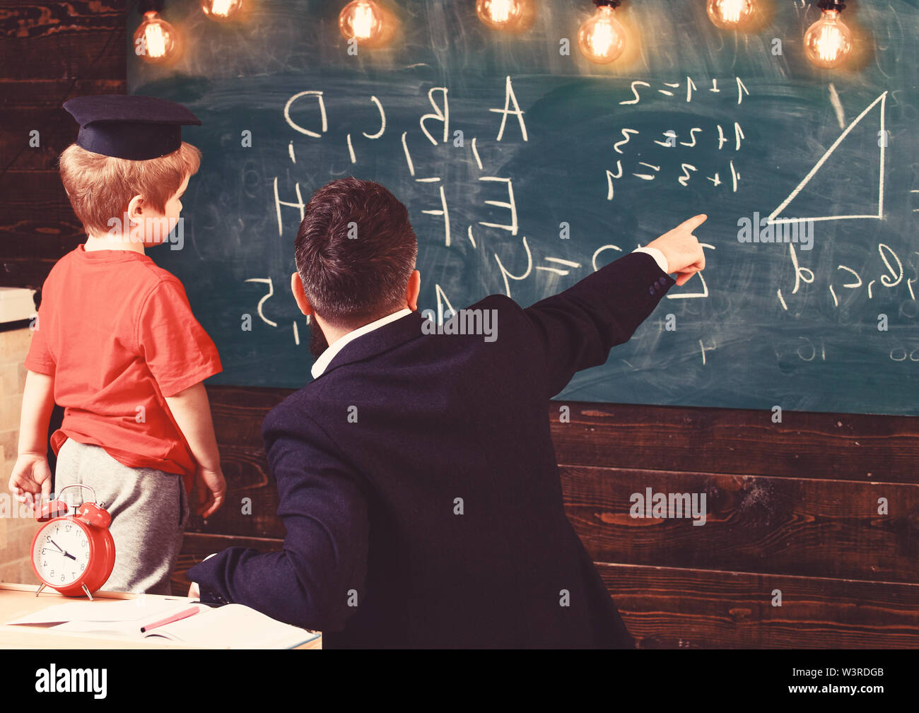 Male teacher pointing chalkboard hi-res stock photography and images ...