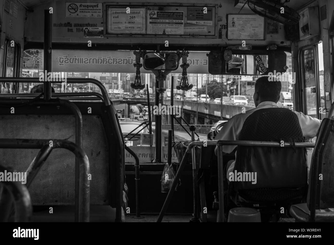 Bus driver sitting at wheel of bus Black and White Stock Photos ...