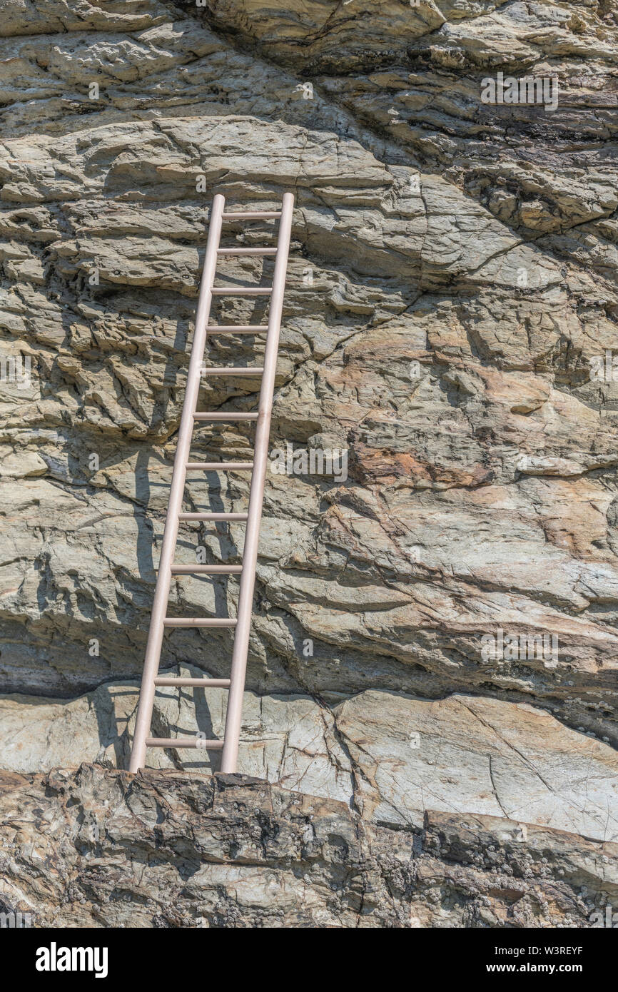 Small wood toy ladder propped against cliff face. Metaphor climbing ...