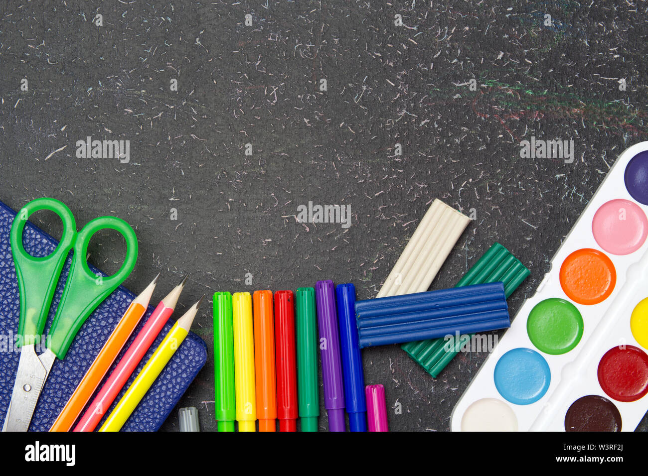 School and office supplies on a blackboard. Stationery Stock Photo - Alamy