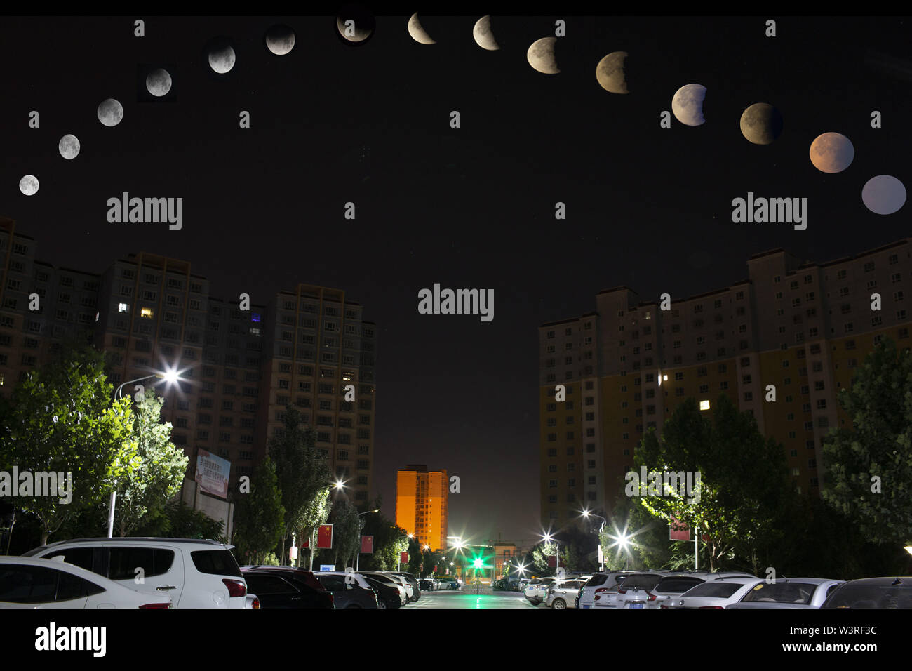 July 17, 2019, Xinjiang, China: Multiple exposure image of the partial lunar eclipse in the ...