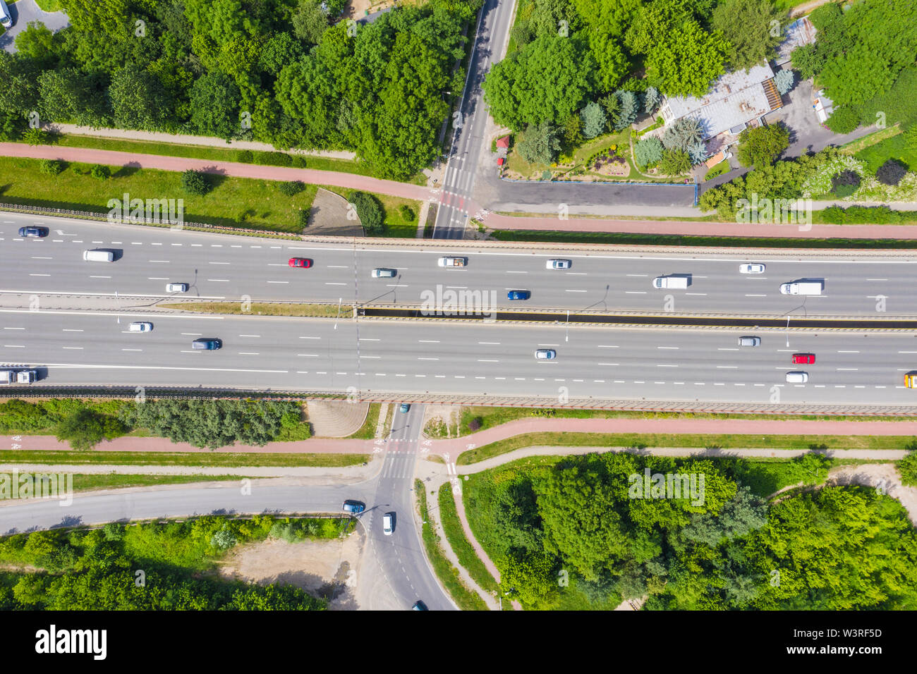 Traffic trails on highway intersection. Aerial View. Green Forest Stock ...