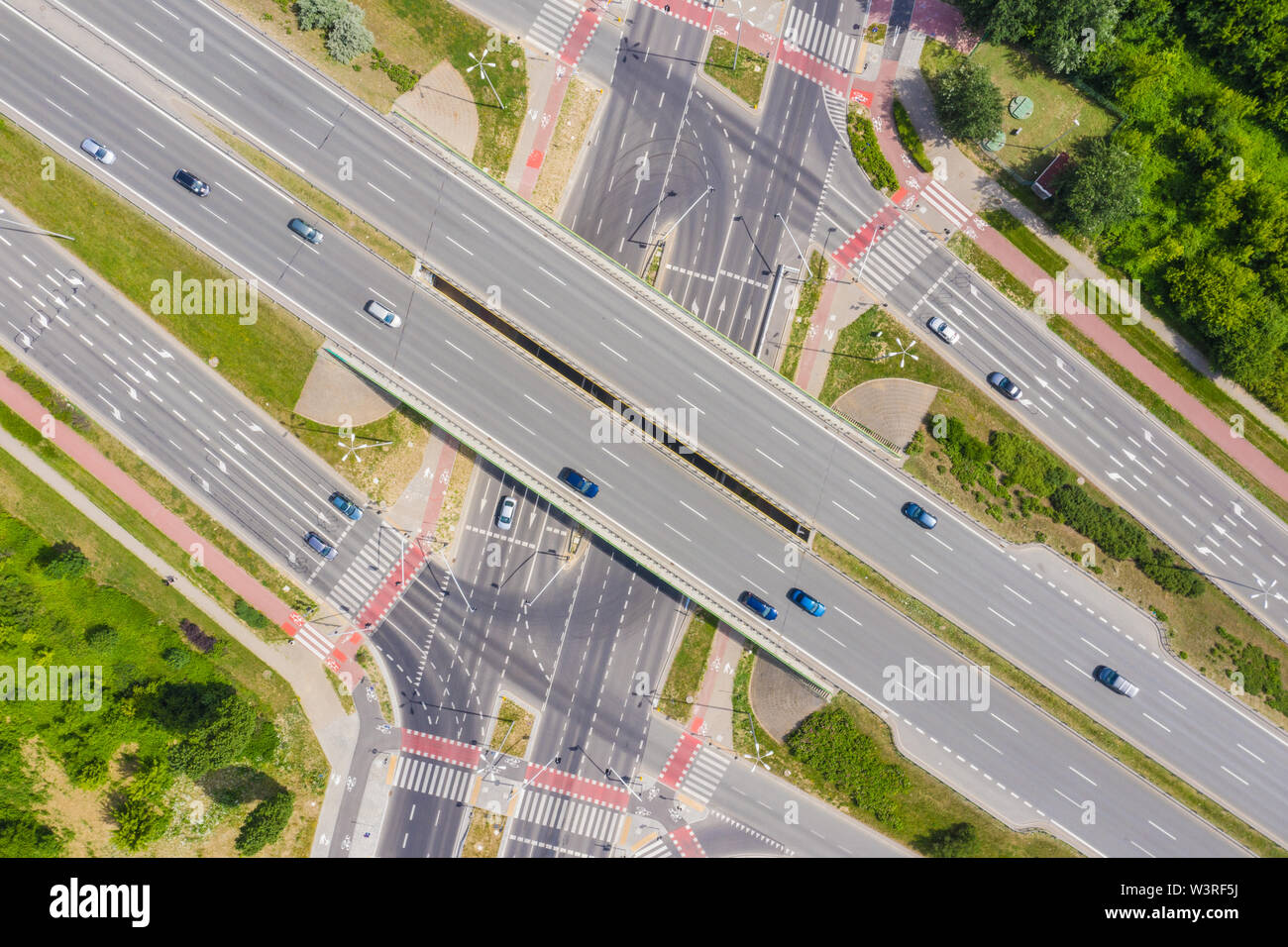 Traffic trails on highway intersection. Aerial View. Green Forest Stock ...