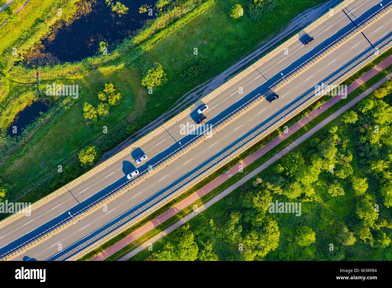 Aerial Drone Flight top down View of freeway busy city rush hour heavy ...
