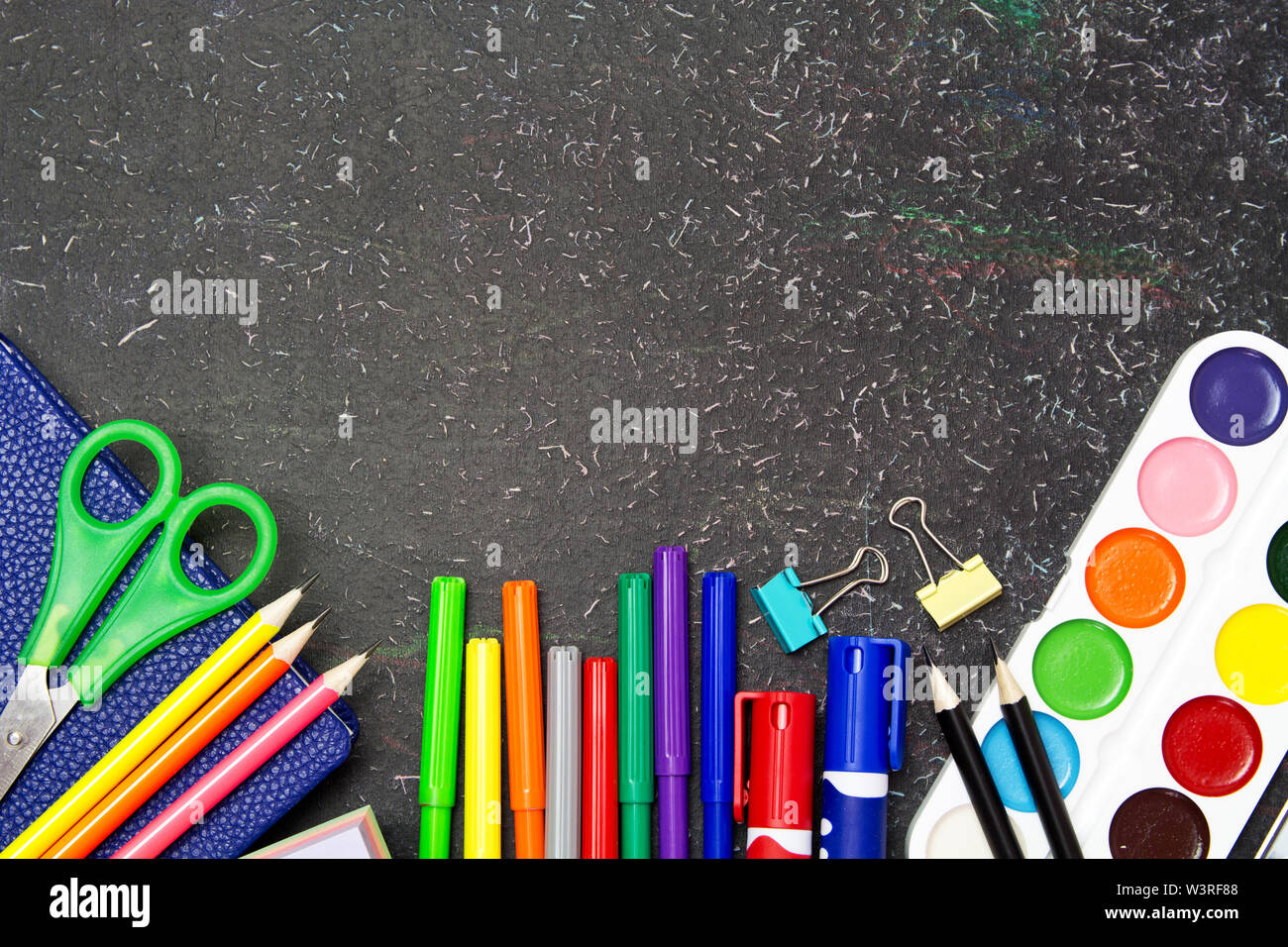 School and office supplies on a blackboard. Stationery Stock Photo - Alamy