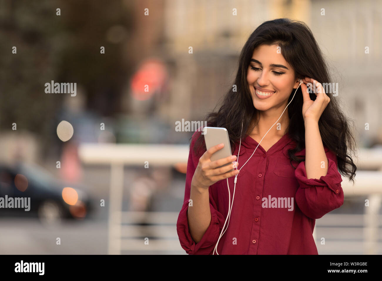 Student girl listening music, spending free time outdoors Stock Photo ...