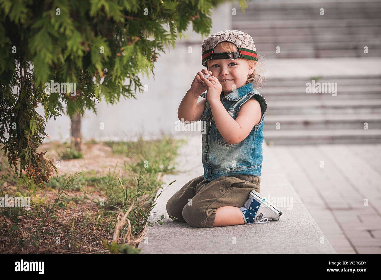 Cute little boy at summer day playing and smiling Stock Photo - Alamy