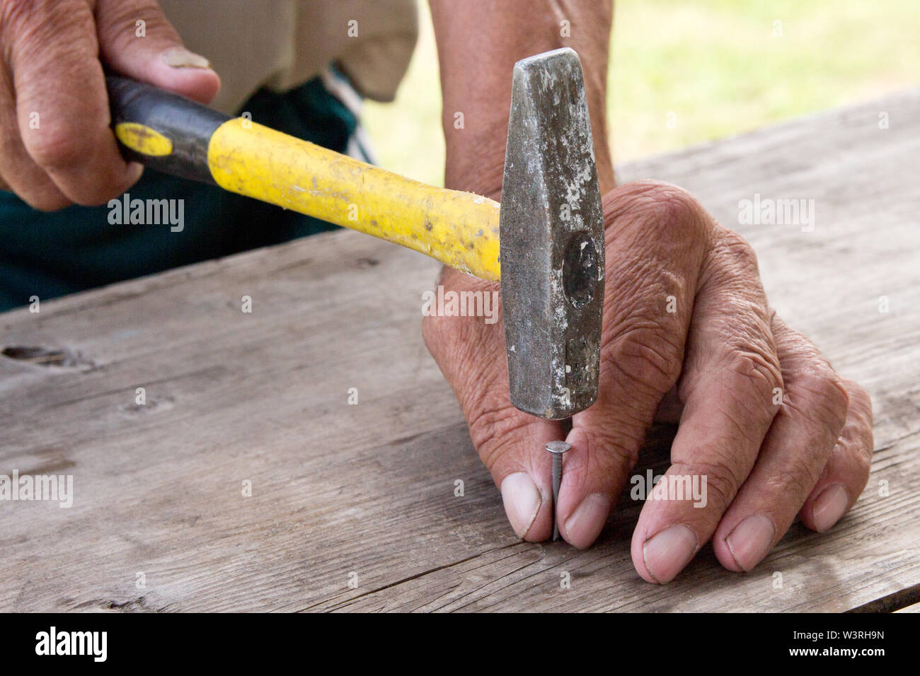 Hand hammer drive nail High Resolution Stock Photography and Images - Alamy