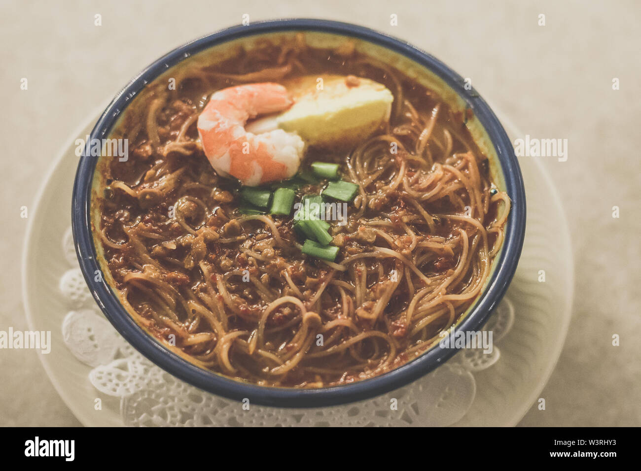 mee siam rice vermicelli in a light assam chilli mee siam broth with ...