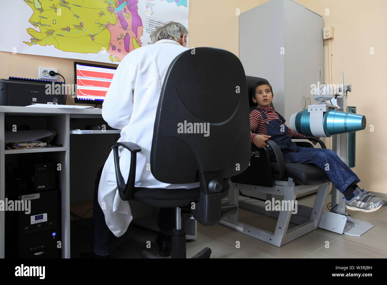 A boy living near the Chernobyl Exclusion Zone is checked with the ...