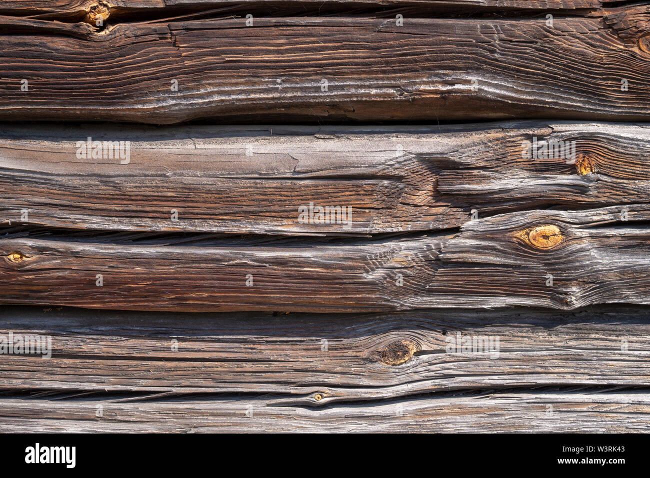 Background texture of old weathered wood cladding on a wall with ...