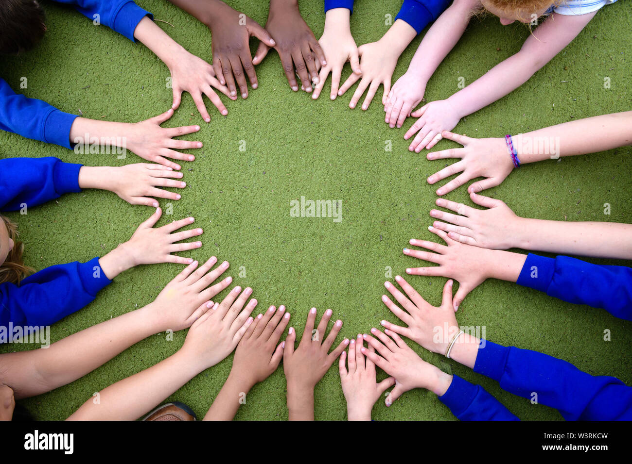 Childrens hands in a circle Stock Photo - Alamy