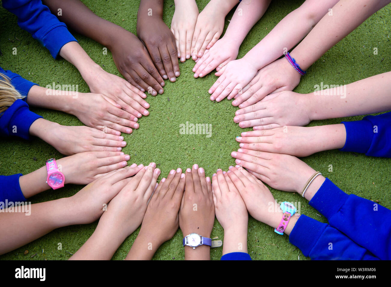 Childrens hands in a circle Stock Photo - Alamy