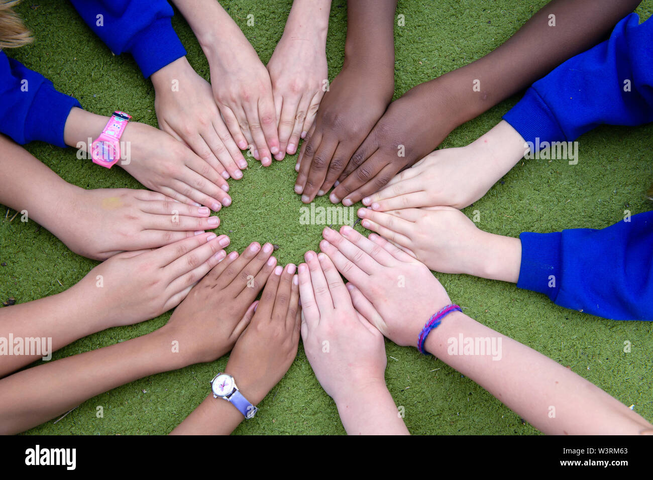 Childrens hands in a circle Stock Photo - Alamy