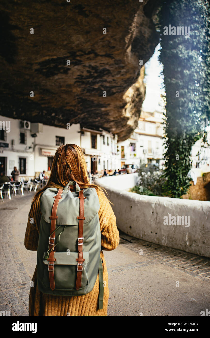Female backpacker walking in the street Stock Photo - Alamy