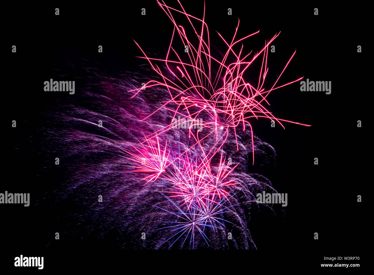 Abstract shot of fireworks being fired into the night sky during 4th of ...