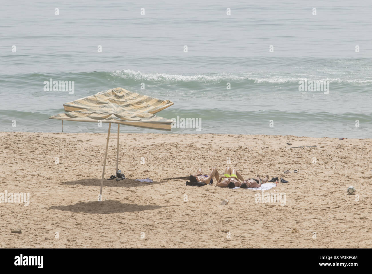 Beirut, Lebanon. 17th July, 2019. A group of people sunbath at the ...