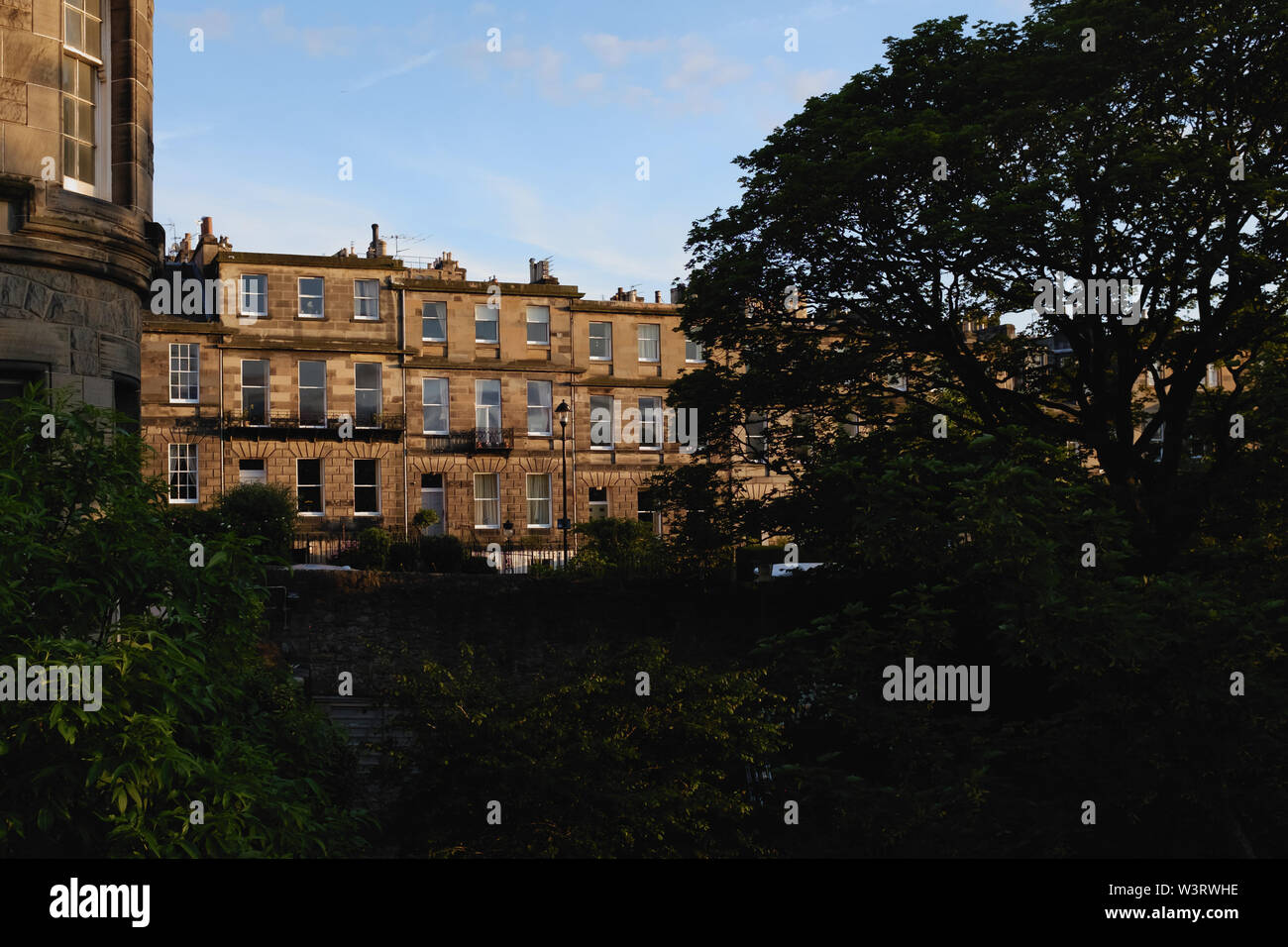 Tenements and trees overlooking Dean Village, viewed from Dean Bridge ...